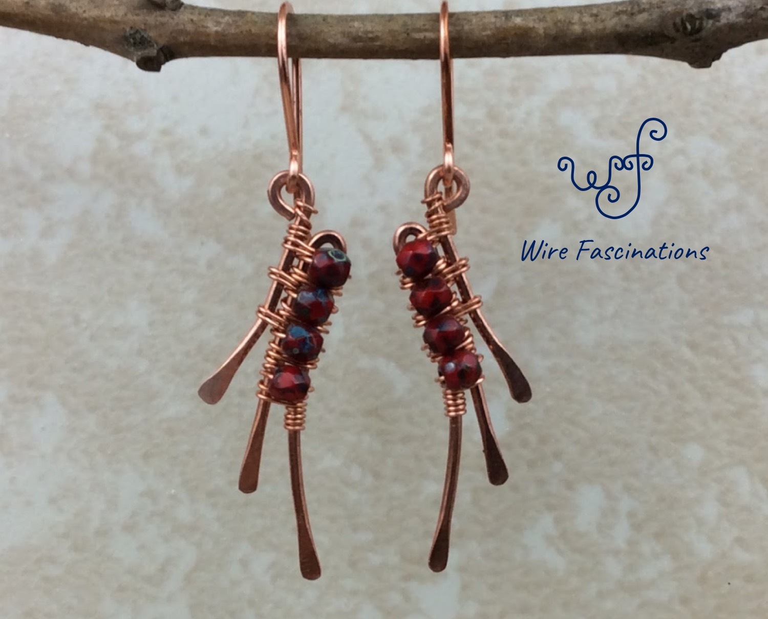 Handmade copper earrings: abstract wire wrapped wings with faceted red ...
