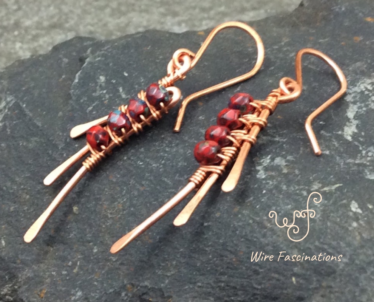 Handmade copper earrings: abstract wire wrapped wings with faceted red ...